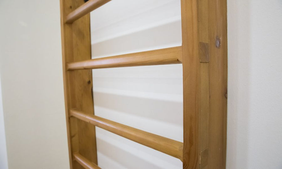 Benefits of Adding Wooden Stall Bars to Your Gym